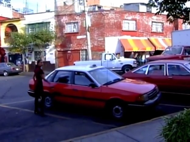 IMCDb.org: 1988 Ford Topaz in "Más allá de la usurpadora, 1998"